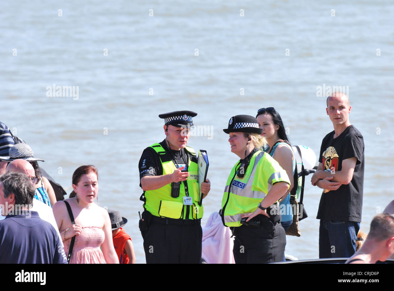 Police helping at seaside event Stock Photo - Alamy