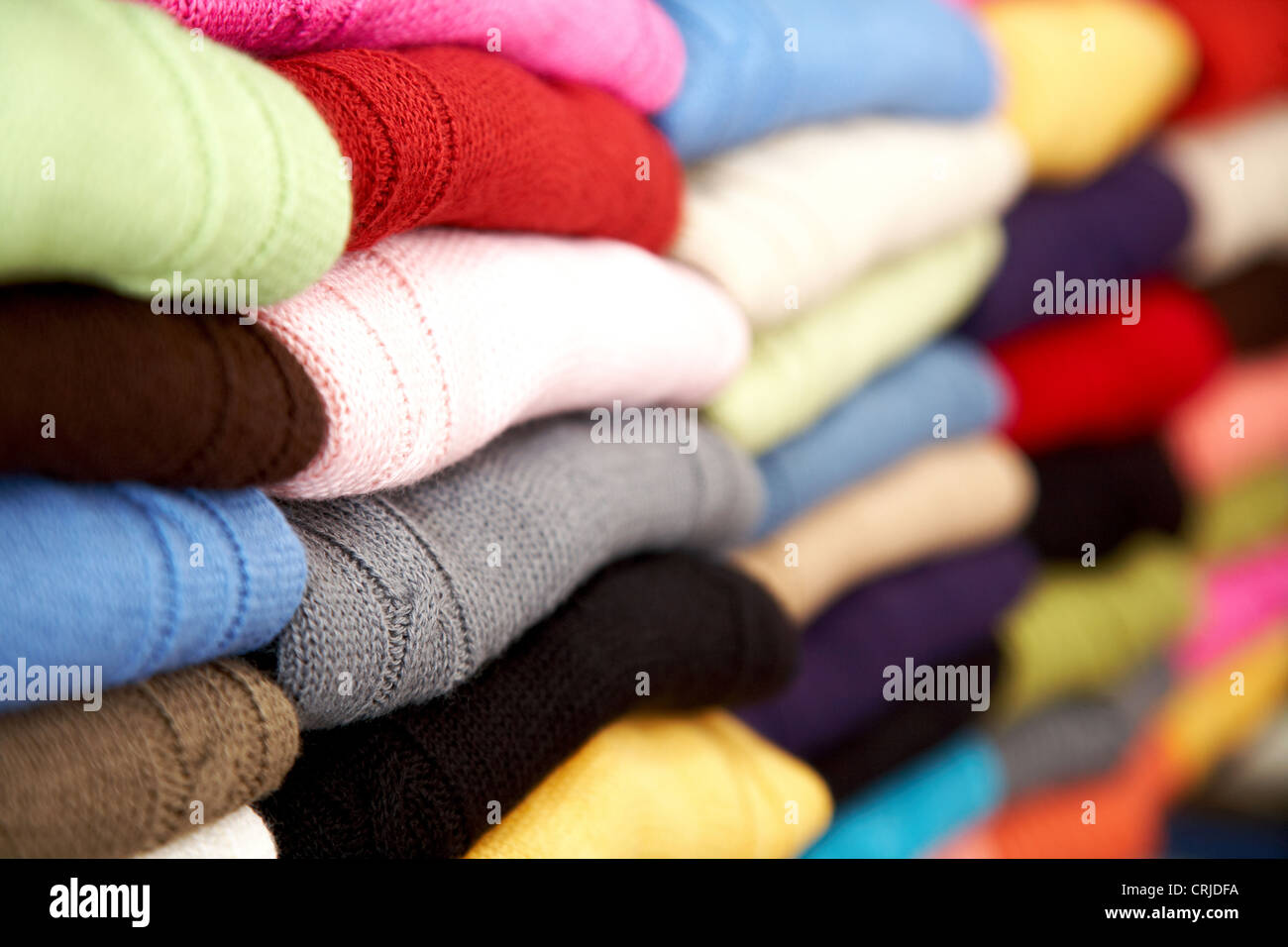 Colourful clothes stacked in retail hi-res stock photography and images ...