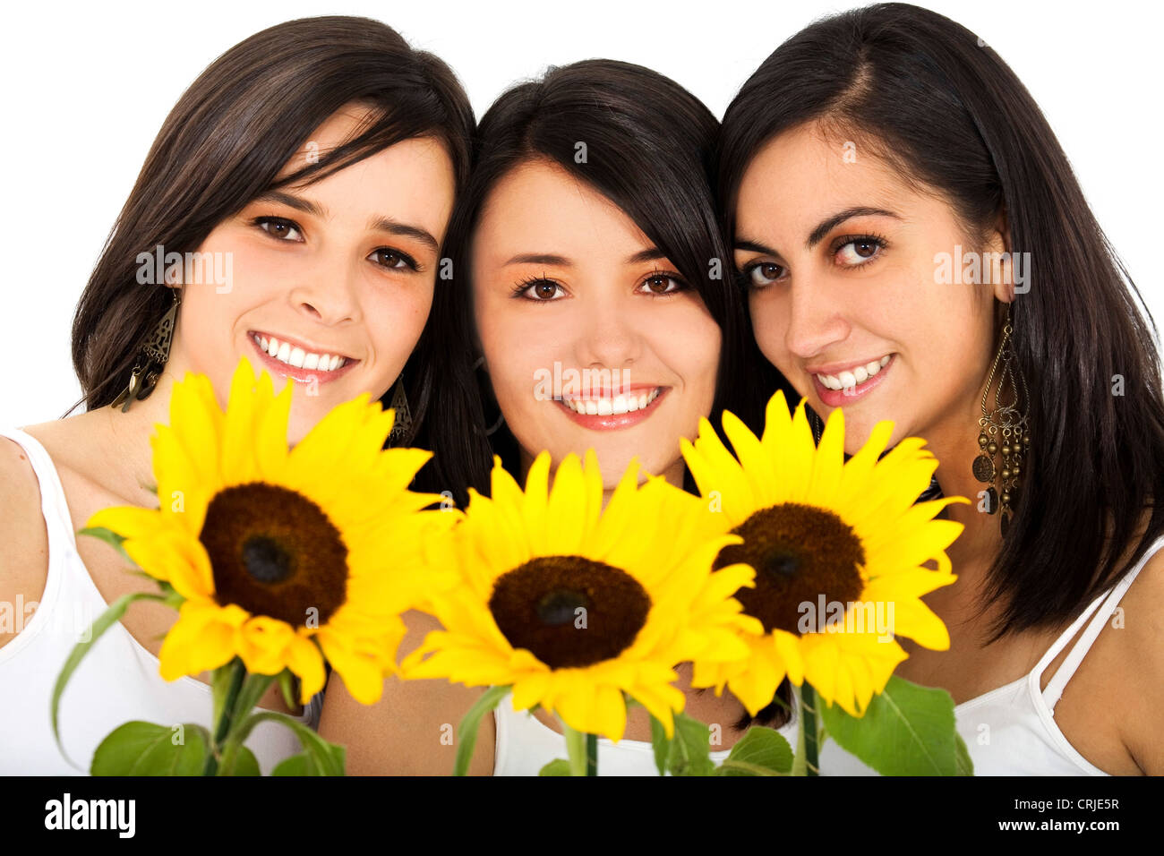 three smiling young women with three sun flowers Stock Photo - Alamy
