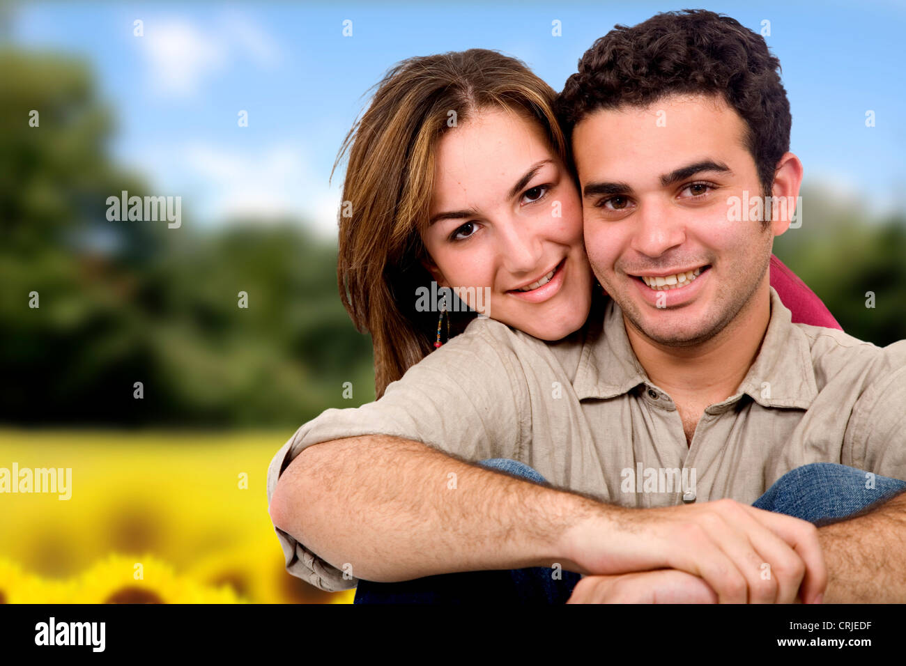 Beautiful couple in love in a park Stock Photo - Alamy