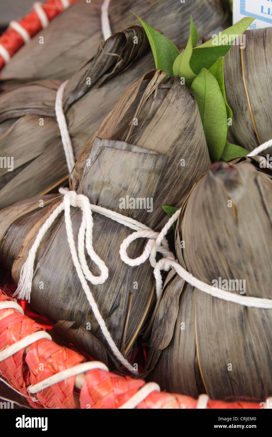 Chinese rice dumplings wrapped in reed leaves Stock Photo - Alamy