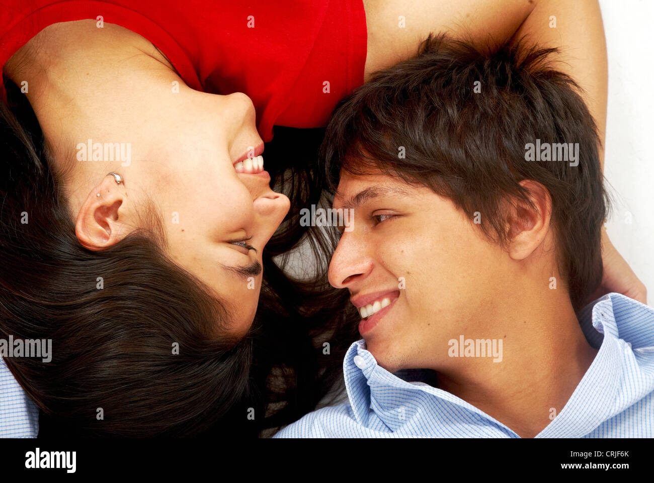 couple of lovers with heads together on the floor Stock Photo - Alamy