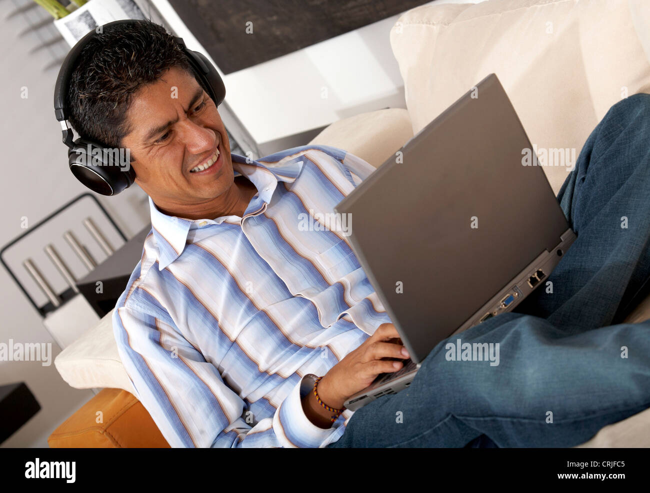 man at home on his laptop computer Stock Photo - Alamy