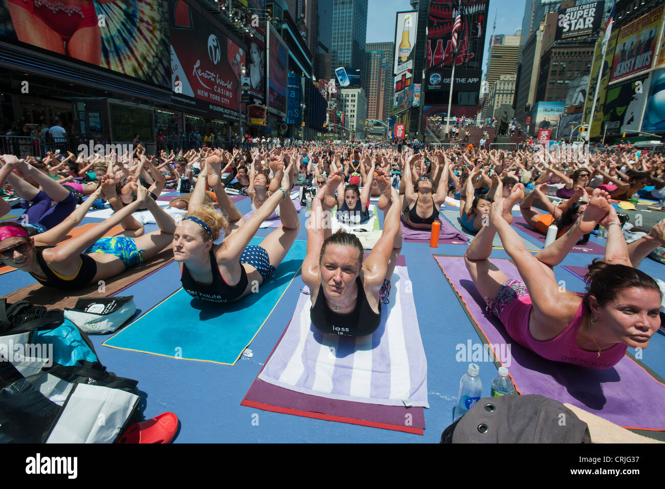 Thousands of yoga practitioners in Times Square in New York participate ...