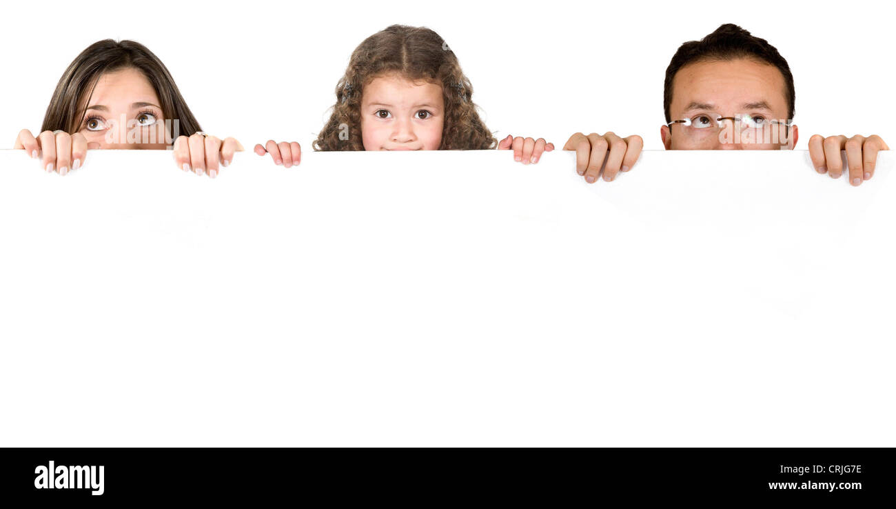 family peeking over a white card Stock Photo - Alamy
