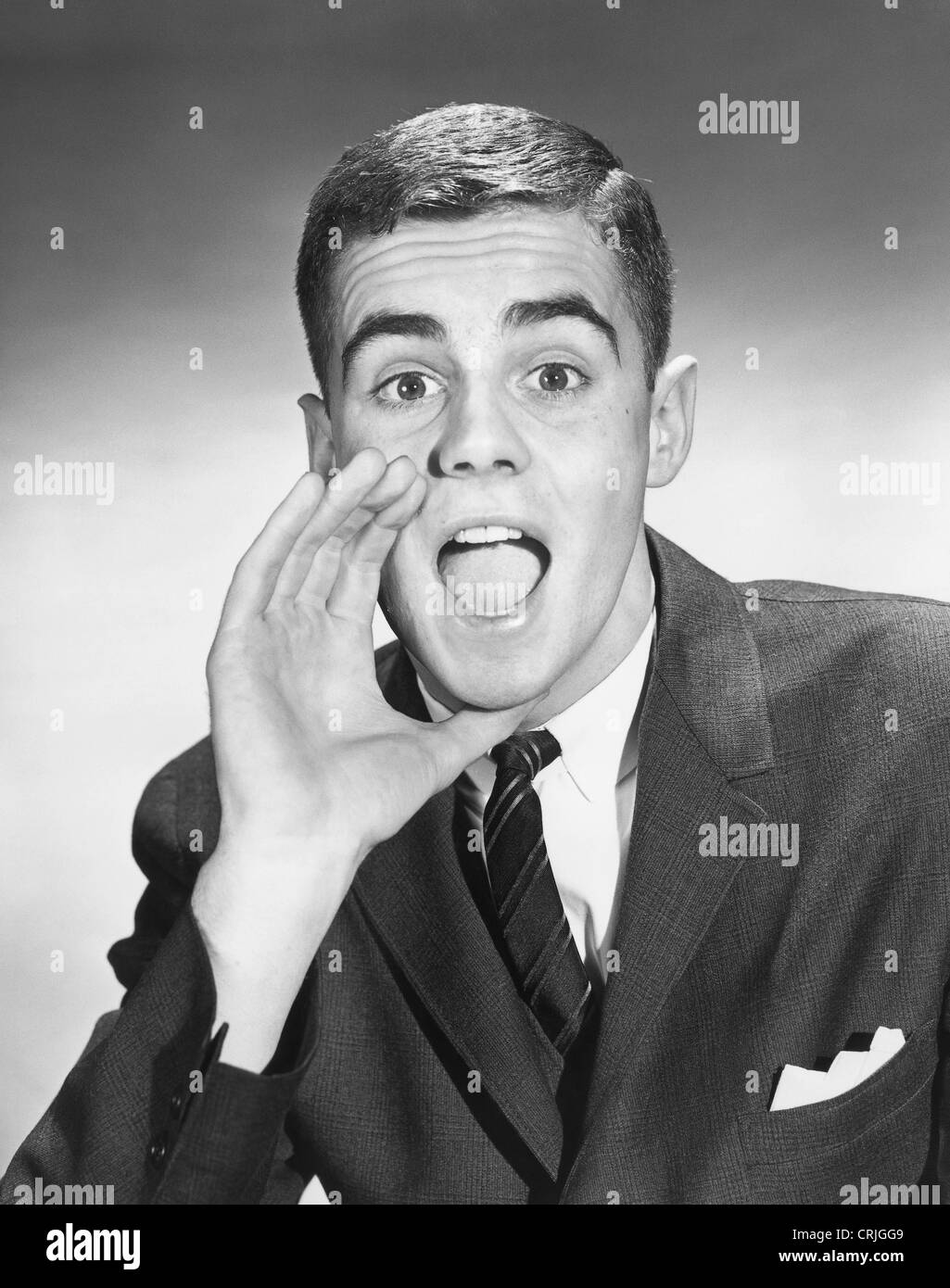 Young businessman yelling out Stock Photo - Alamy