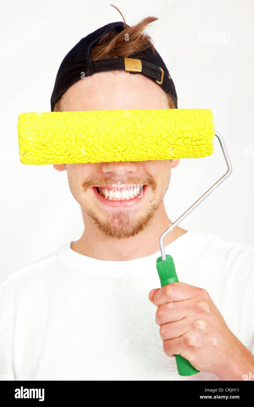 Man hand roller painting yellow hi-res stock photography and images - Alamy