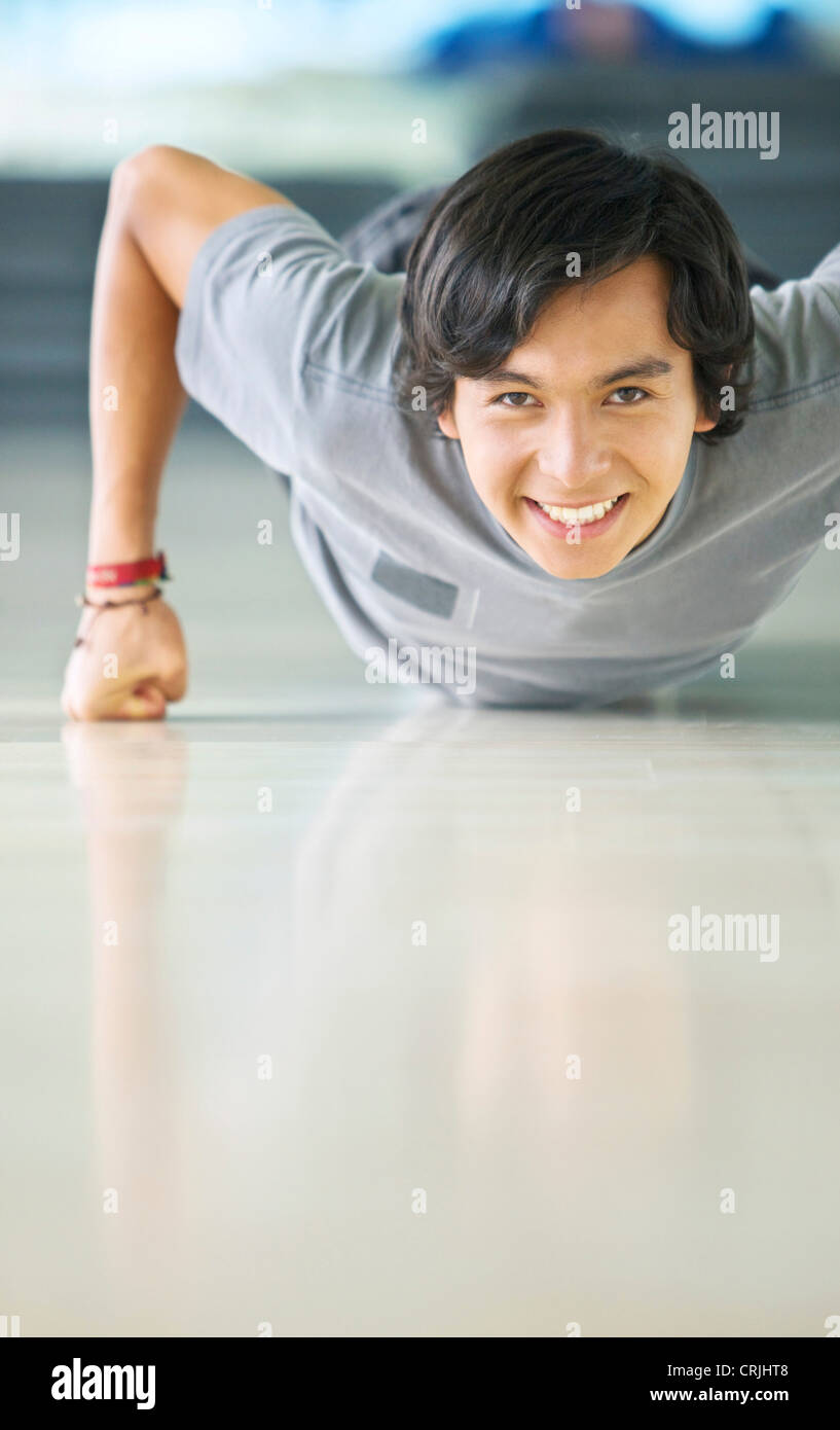 Man at the gym doing push ups Stock Photo - Alamy