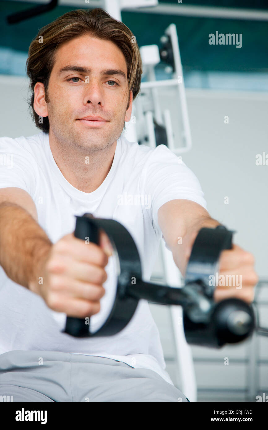 Man working out at the gym looking serious Stock Photo - Alamy