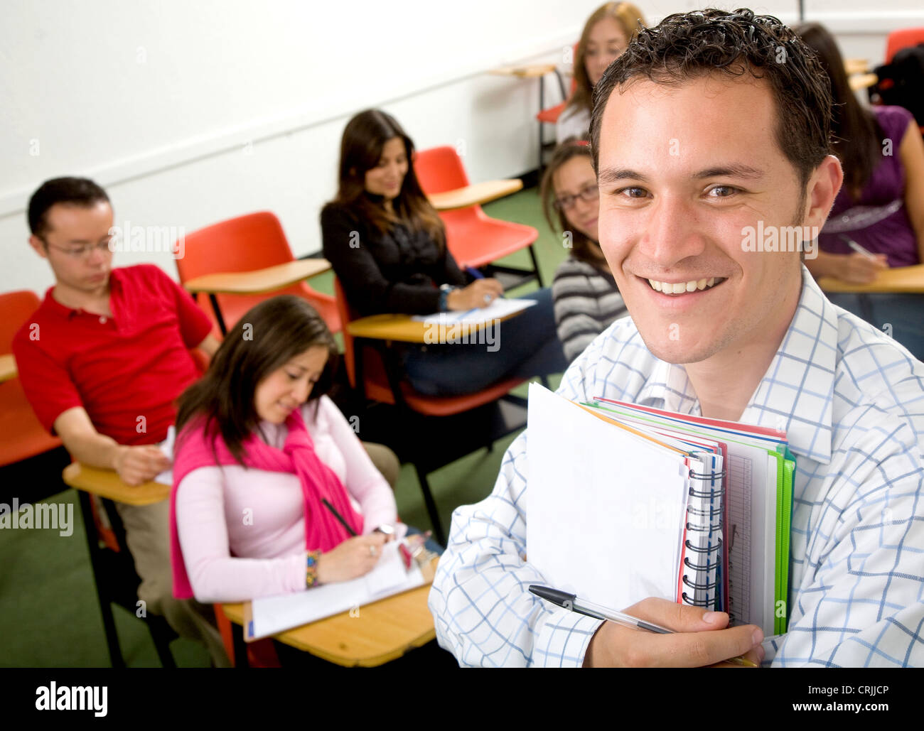 casual student or teacher in a classroom full of students Stock Photo ...