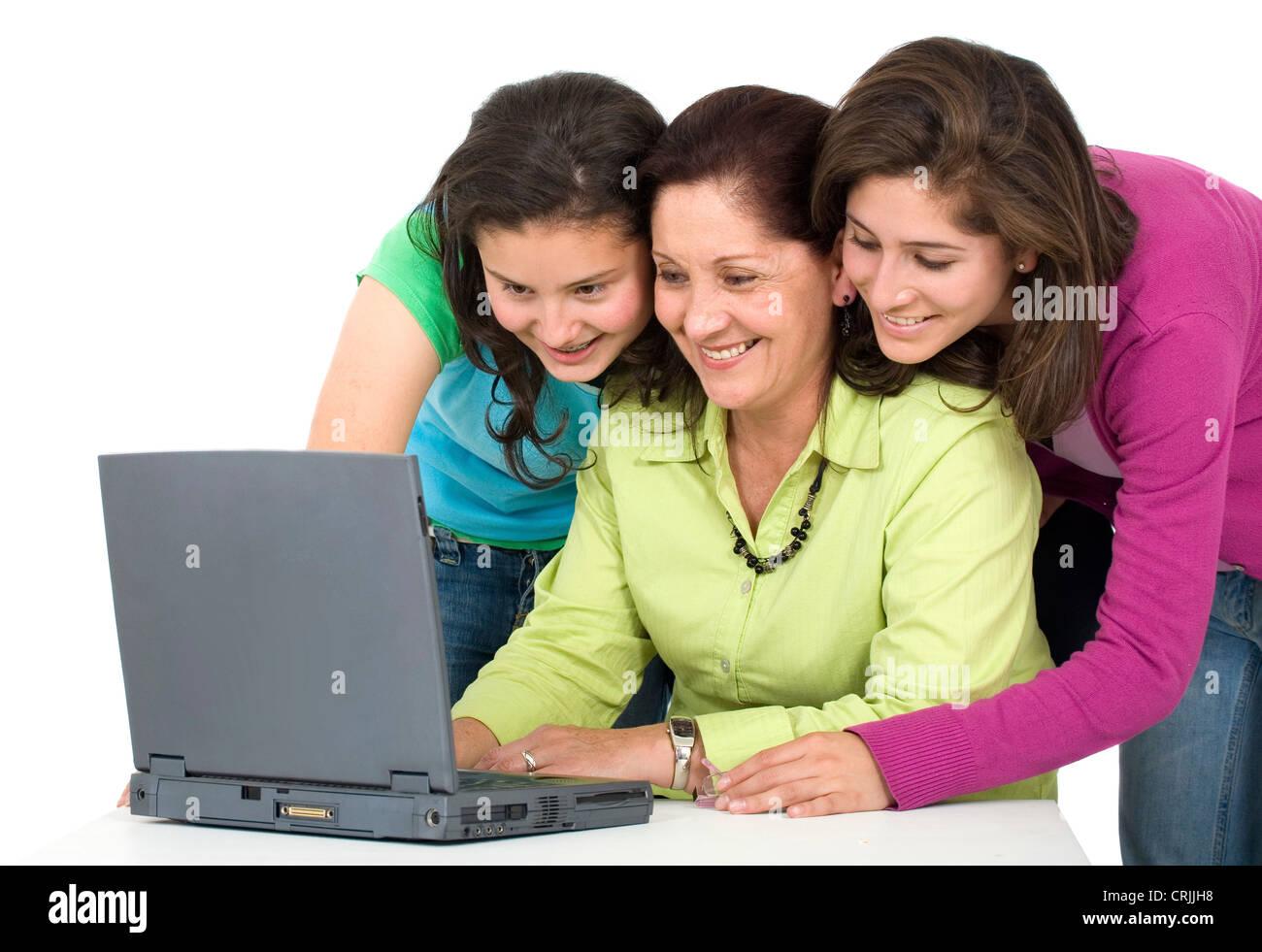 family on a laptop computer smiling Stock Photo - Alamy