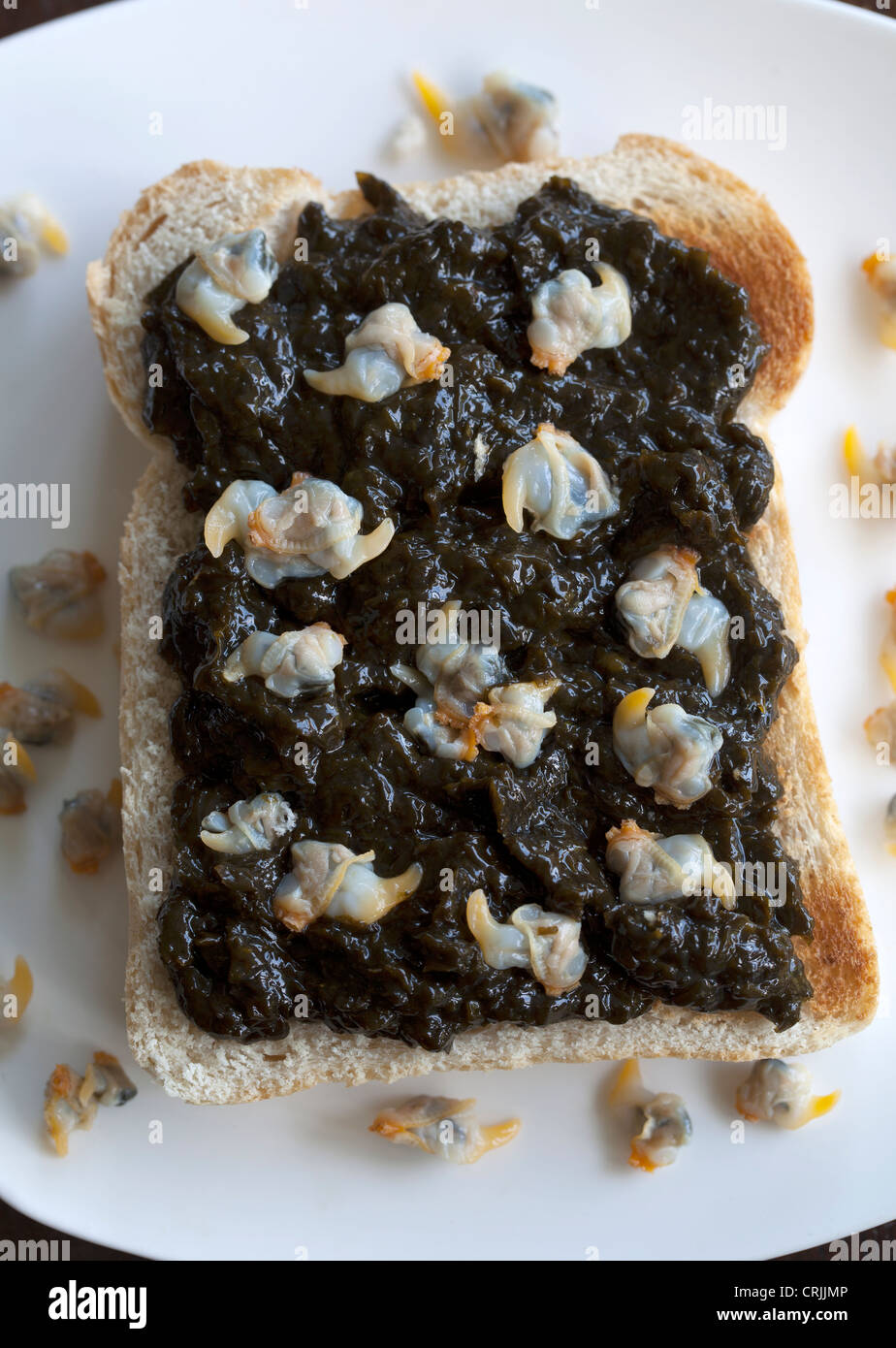 Welsh Breakfast of Laver Bread on Toast with Cockles Stock Photo - Alamy