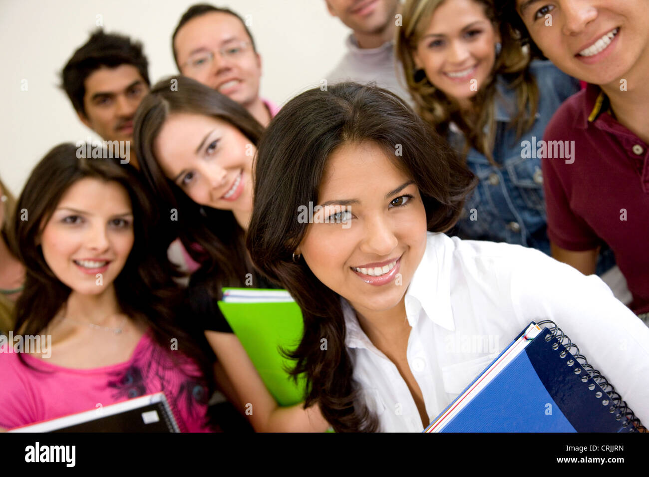 friends or university students smiling in a classroom Stock Photo - Alamy