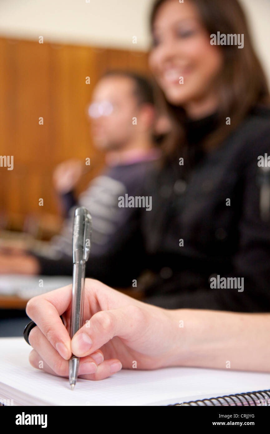 Student writing by hand with a pen Stock Photo - Alamy