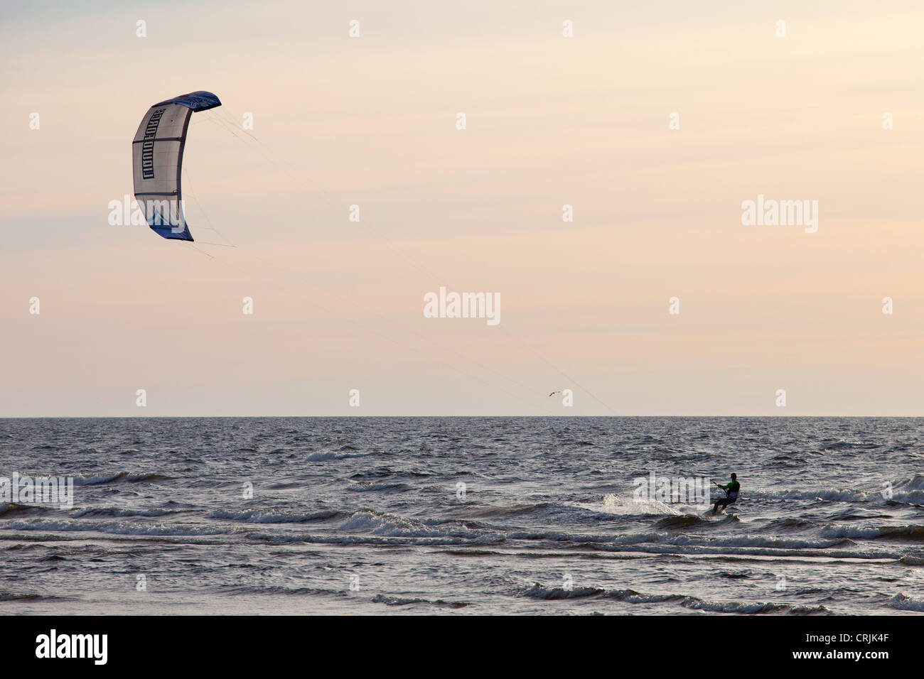 Windsurfer in action using windy weather to feed the kite Stock Photo ...