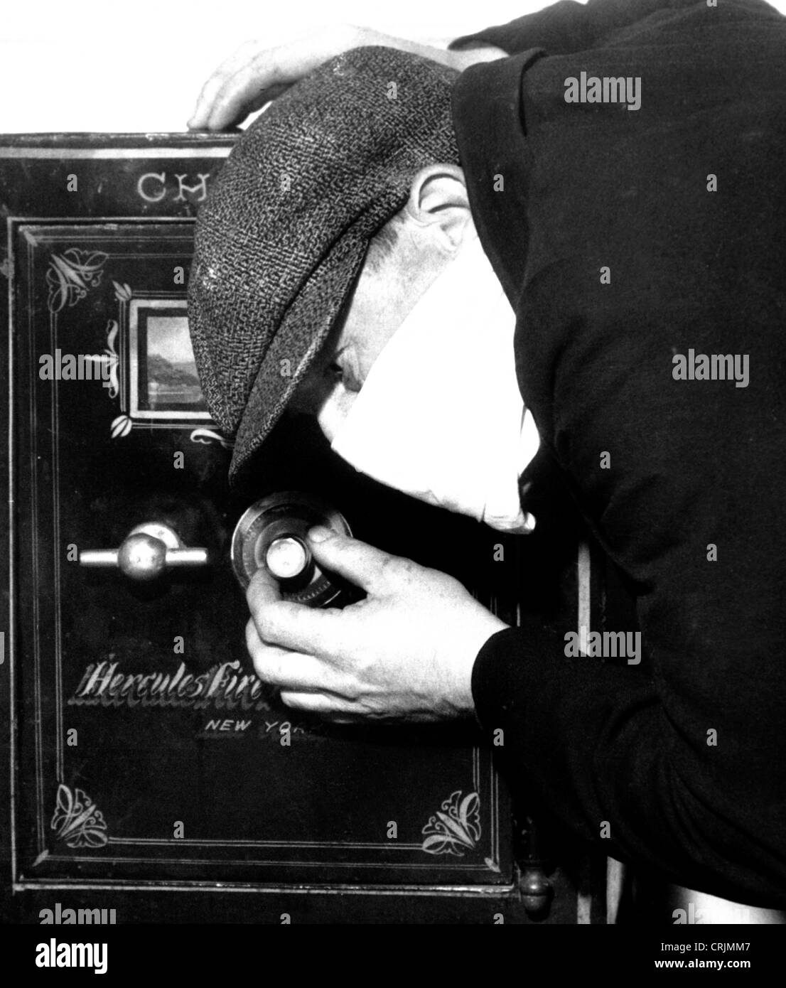 Man robbing a safe Stock Photo - Alamy