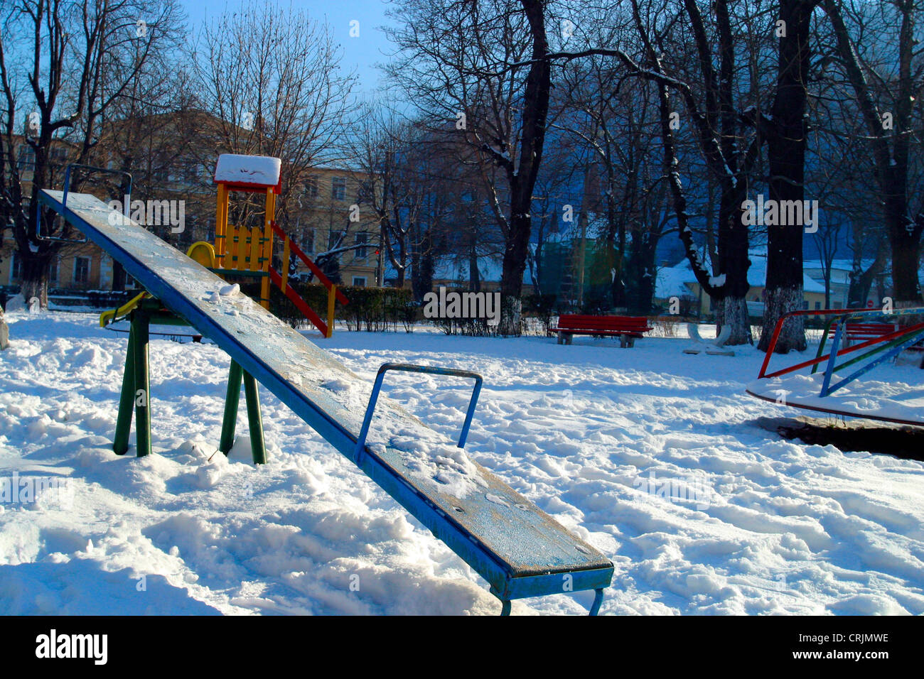 children's playground covered in snow, Romania, Transsylvania, Brasov ...