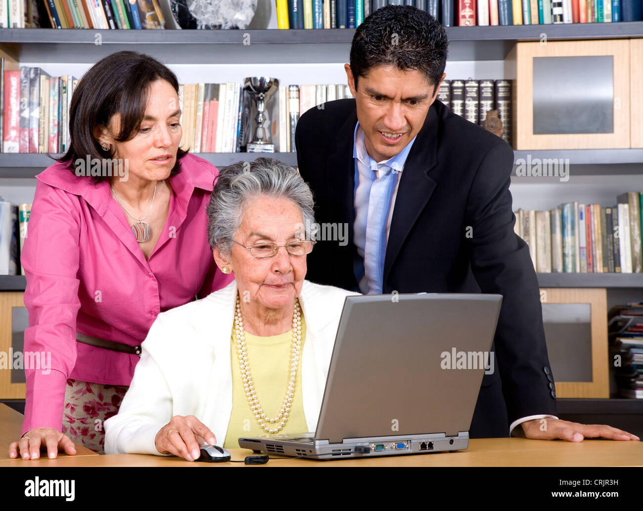 adult online education concept using a family on a laptop computer at ...