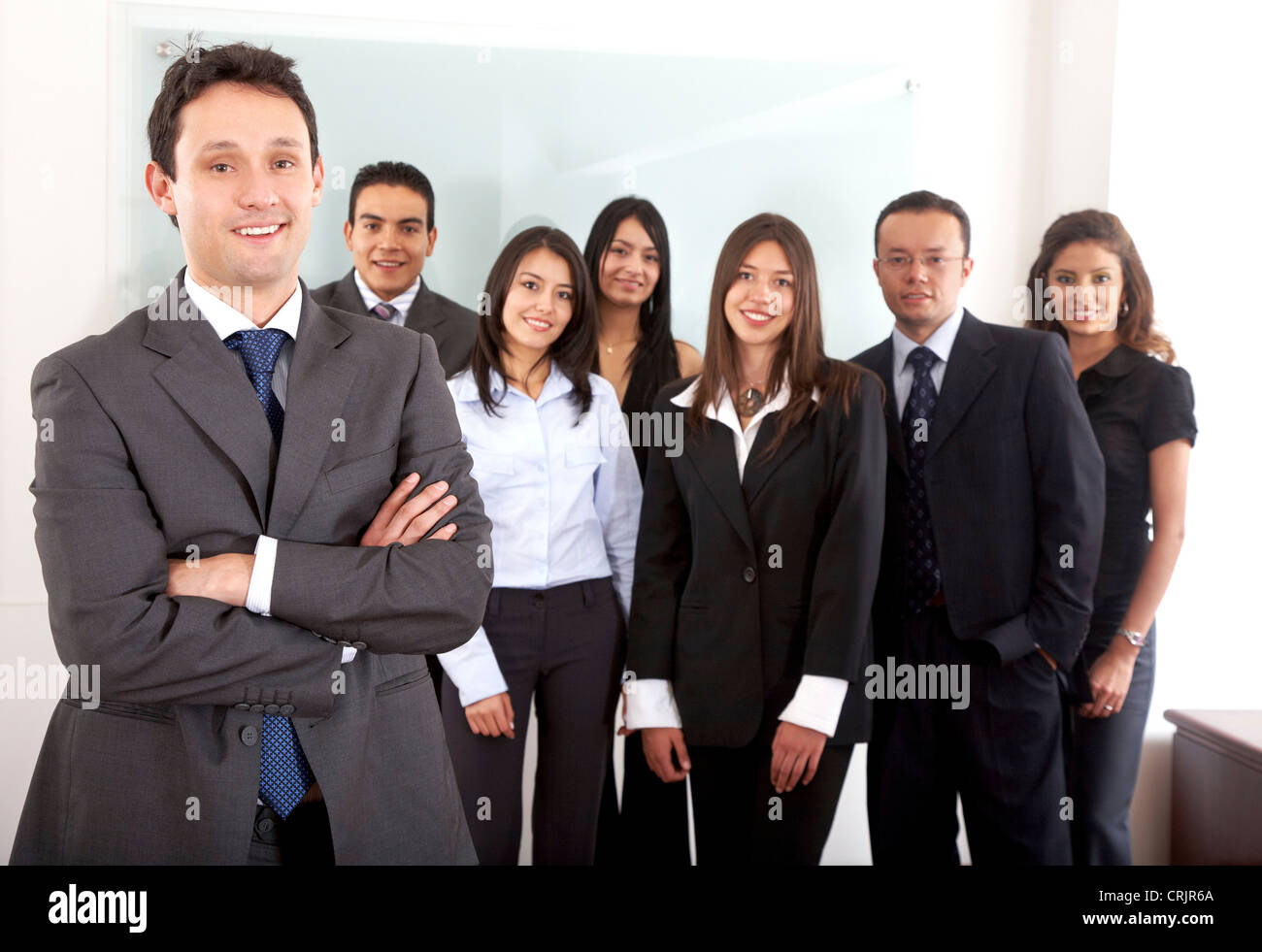 group of business people lead by a businessman Stock Photo - Alamy