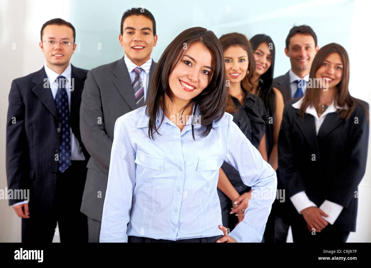 business office team smiling with a woman leading it Stock Photo - Alamy