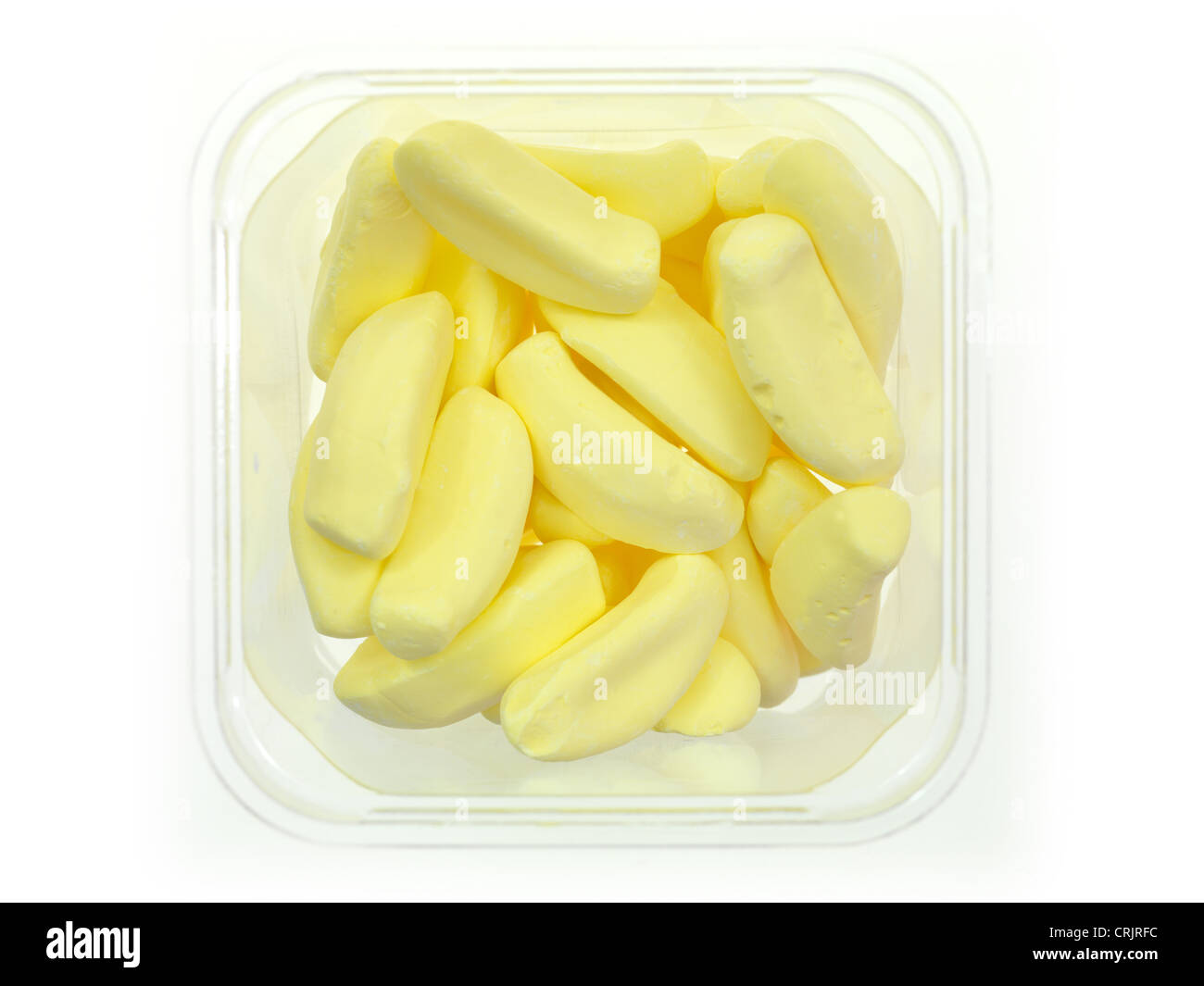 Candy bananas isolated against a white background Stock Photo - Alamy