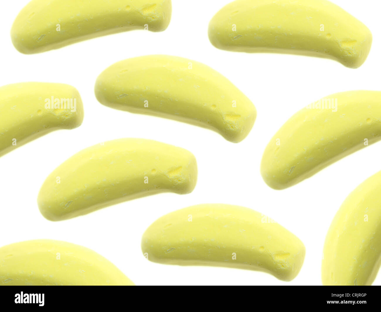 Candy bananas isolated against a white background Stock Photo - Alamy