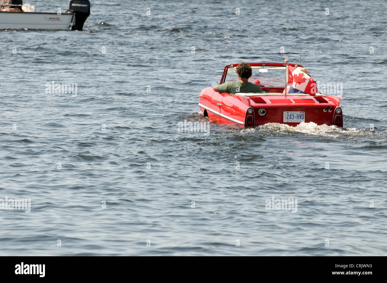Red car converted into a boat Stock Photo - Alamy