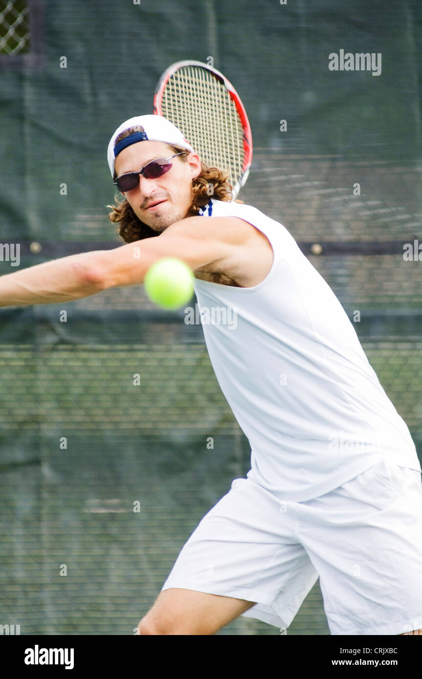 Tennis player sizing up a swing Stock Photo - Alamy