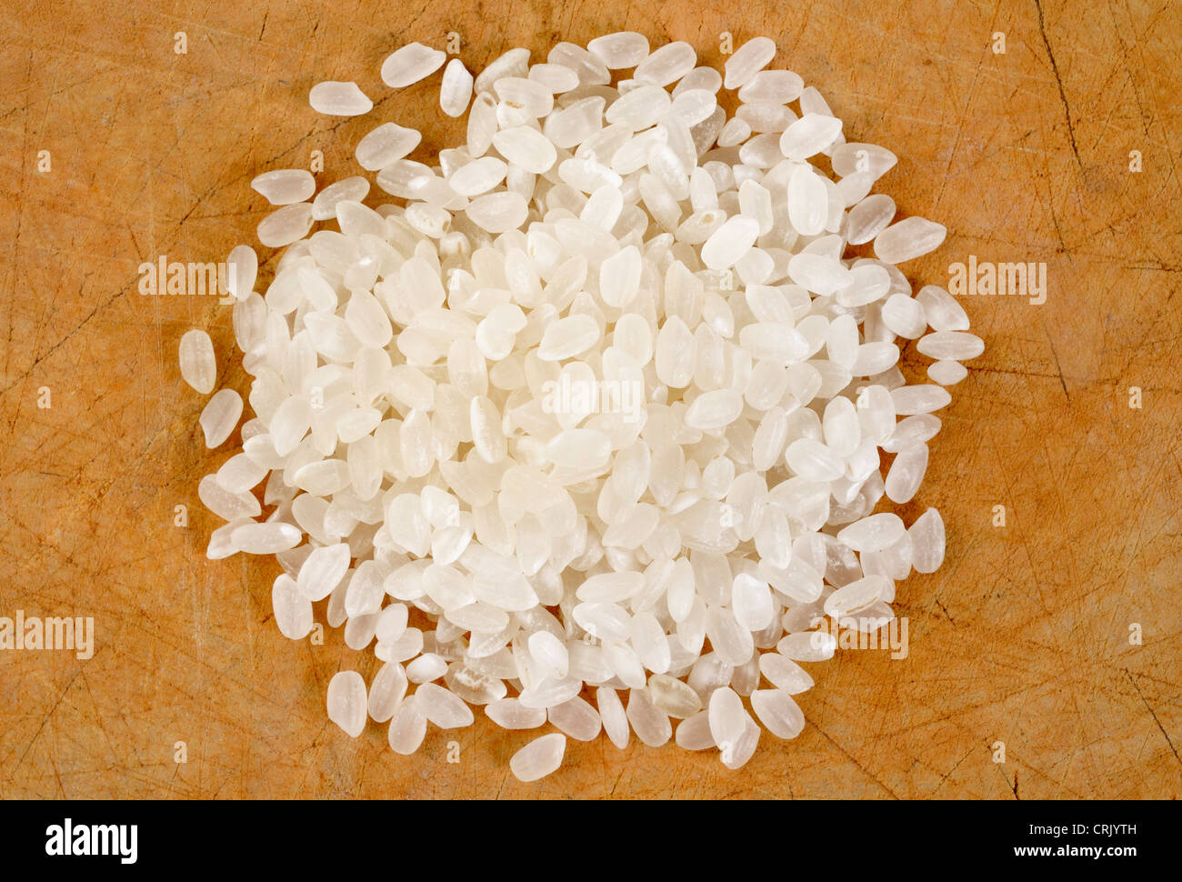 pile japanese rice on wood background Stock Photo - Alamy
