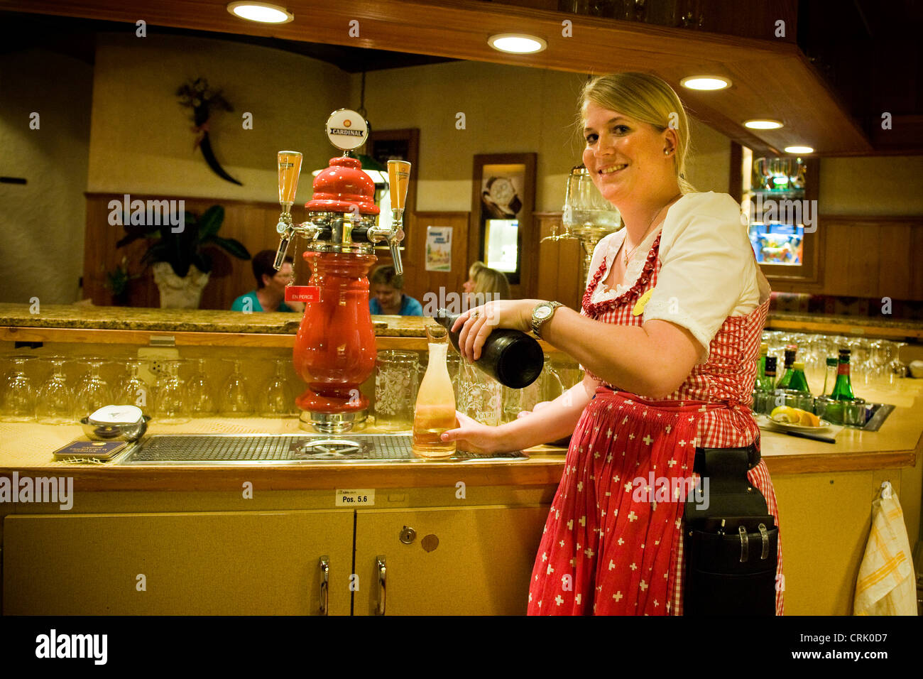 Switzerland, Canton Valais, Zermatt, waitress in traditional costume ...