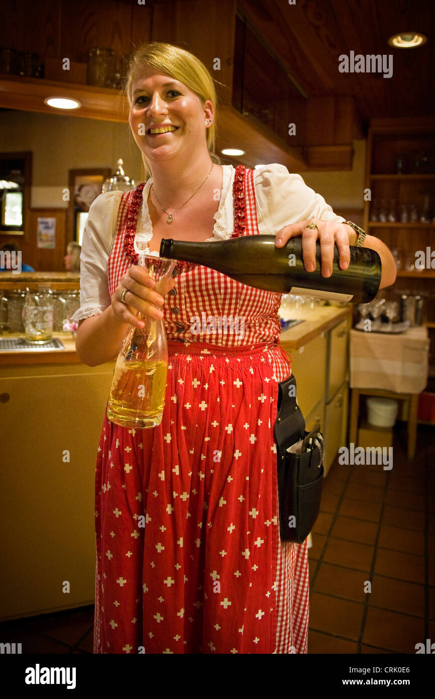 Switzerland, Canton Valais, Zermatt, waitress in traditional costume ...