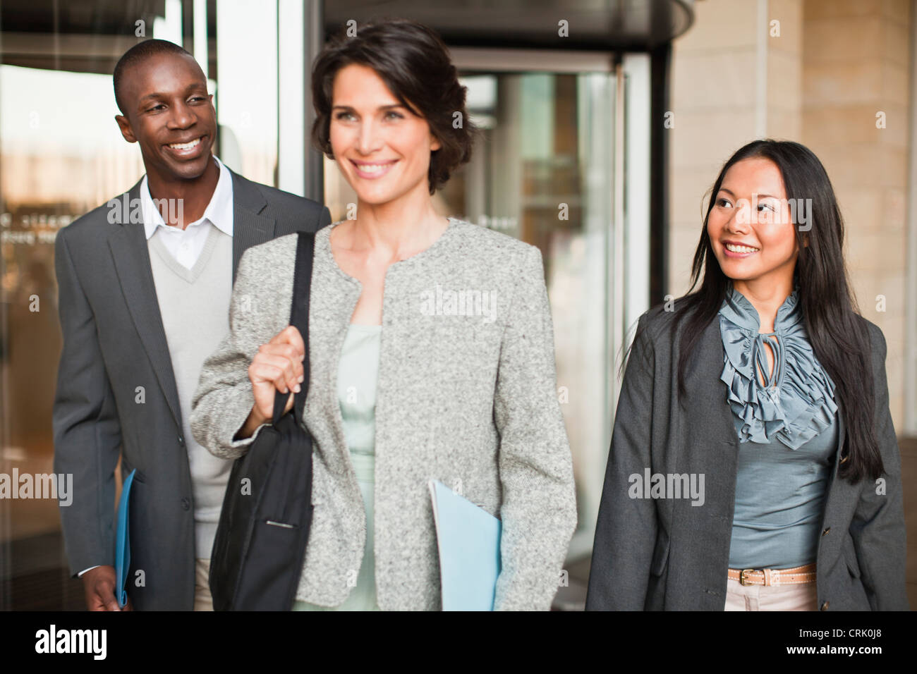 Business people walking outside building Stock Photo - Alamy
