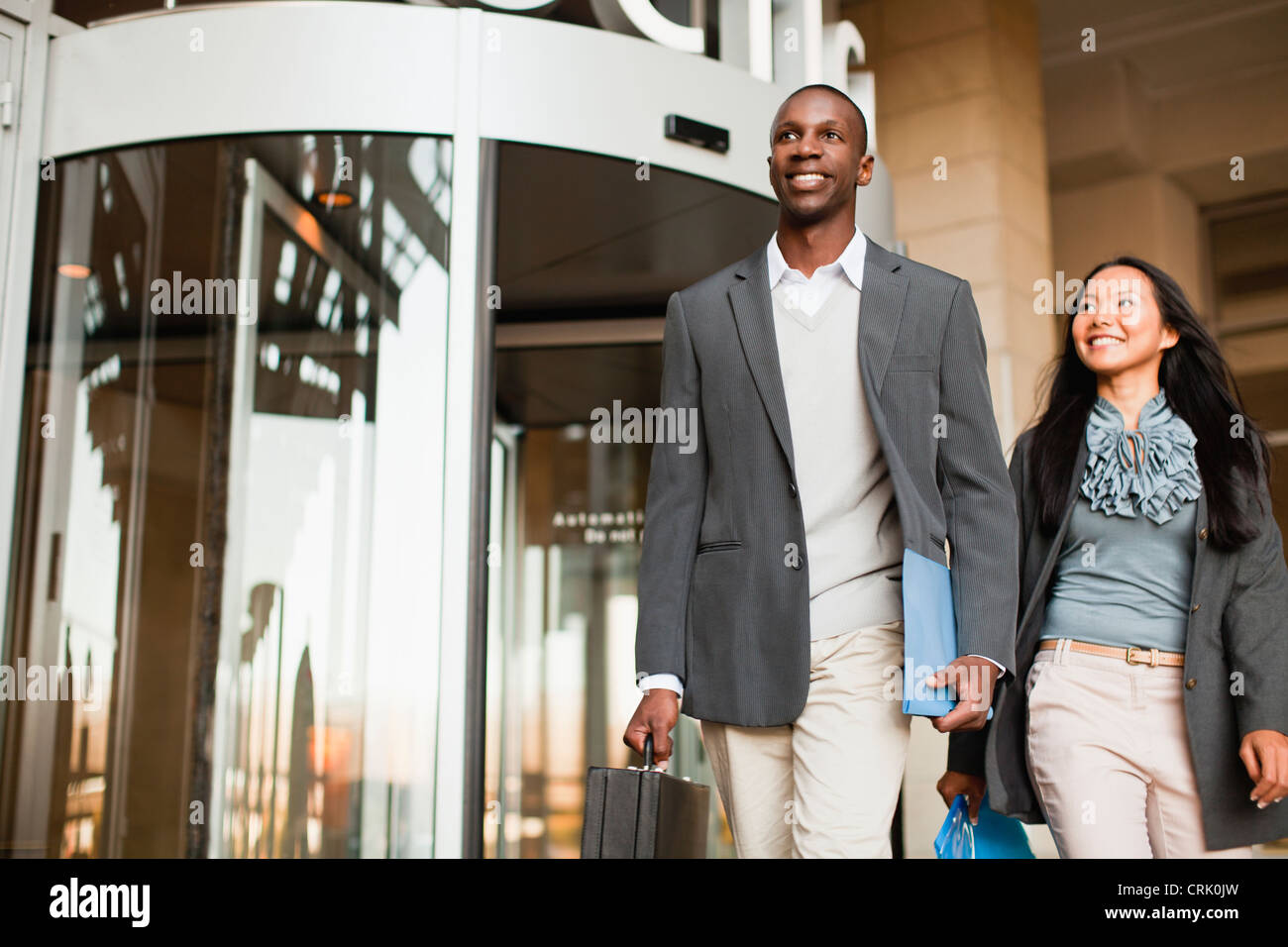 Business people walking outside building Stock Photo - Alamy