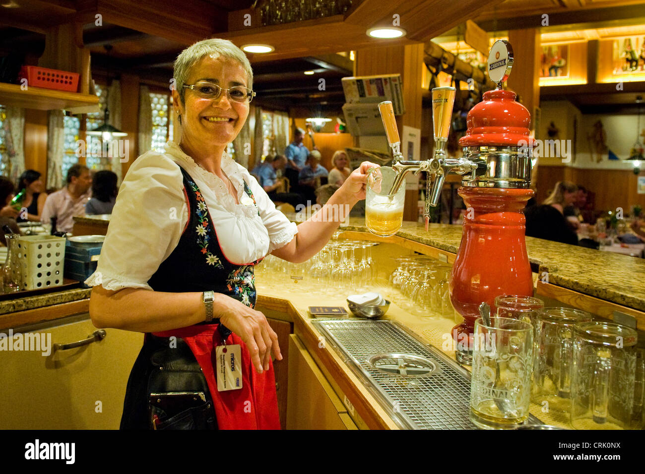 Barmaid pulling a pint hi-res stock photography and images - Alamy