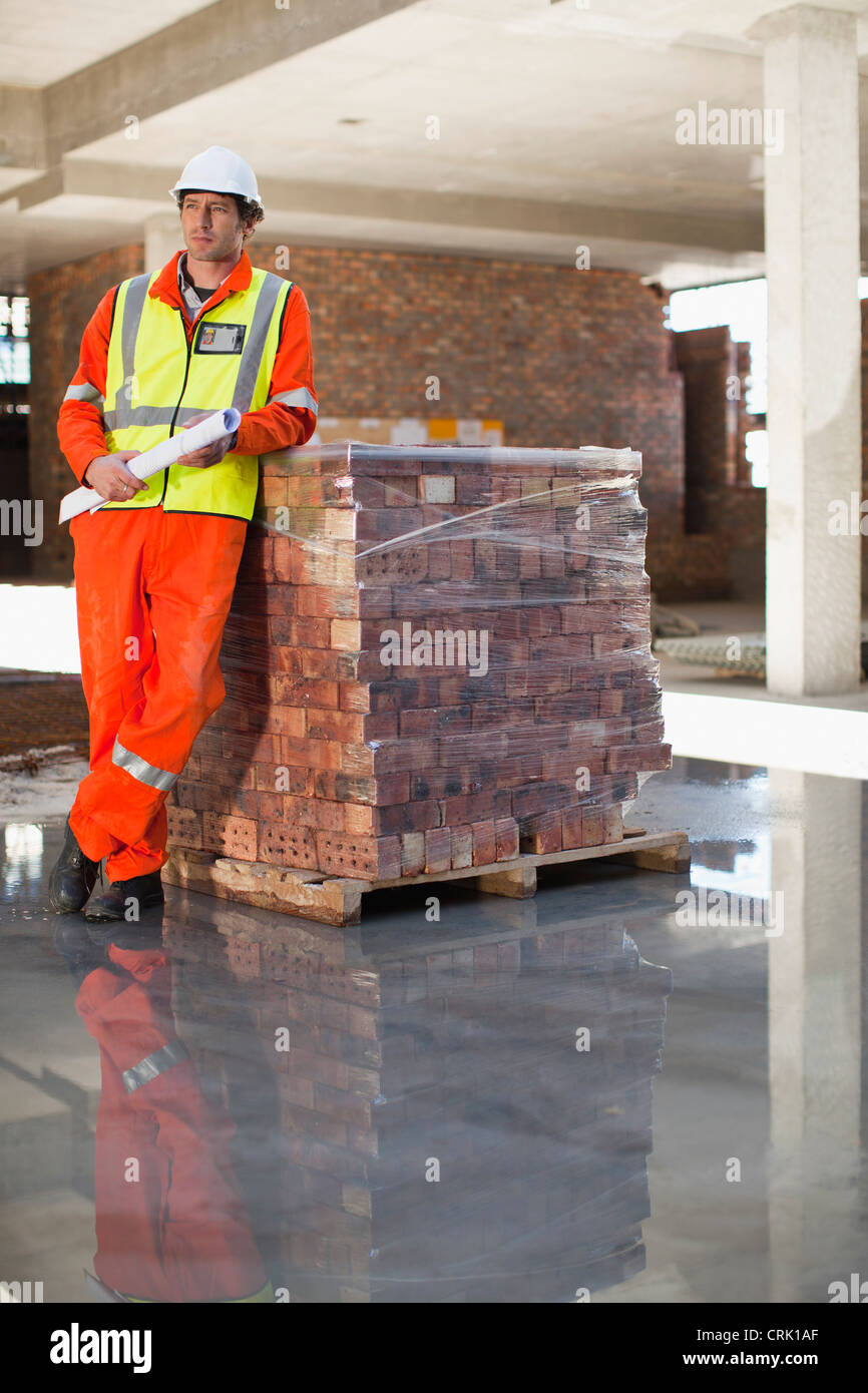 Workers standing at construction site Stock Photo - Alamy
