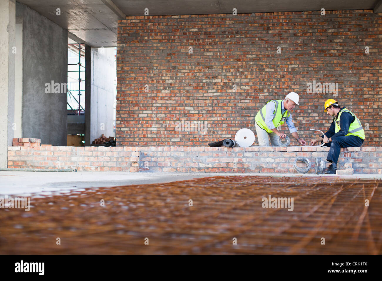 Construction worker on building site Stock Photo - Alamy