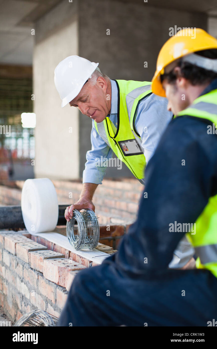 Construction worker on building site Stock Photo - Alamy