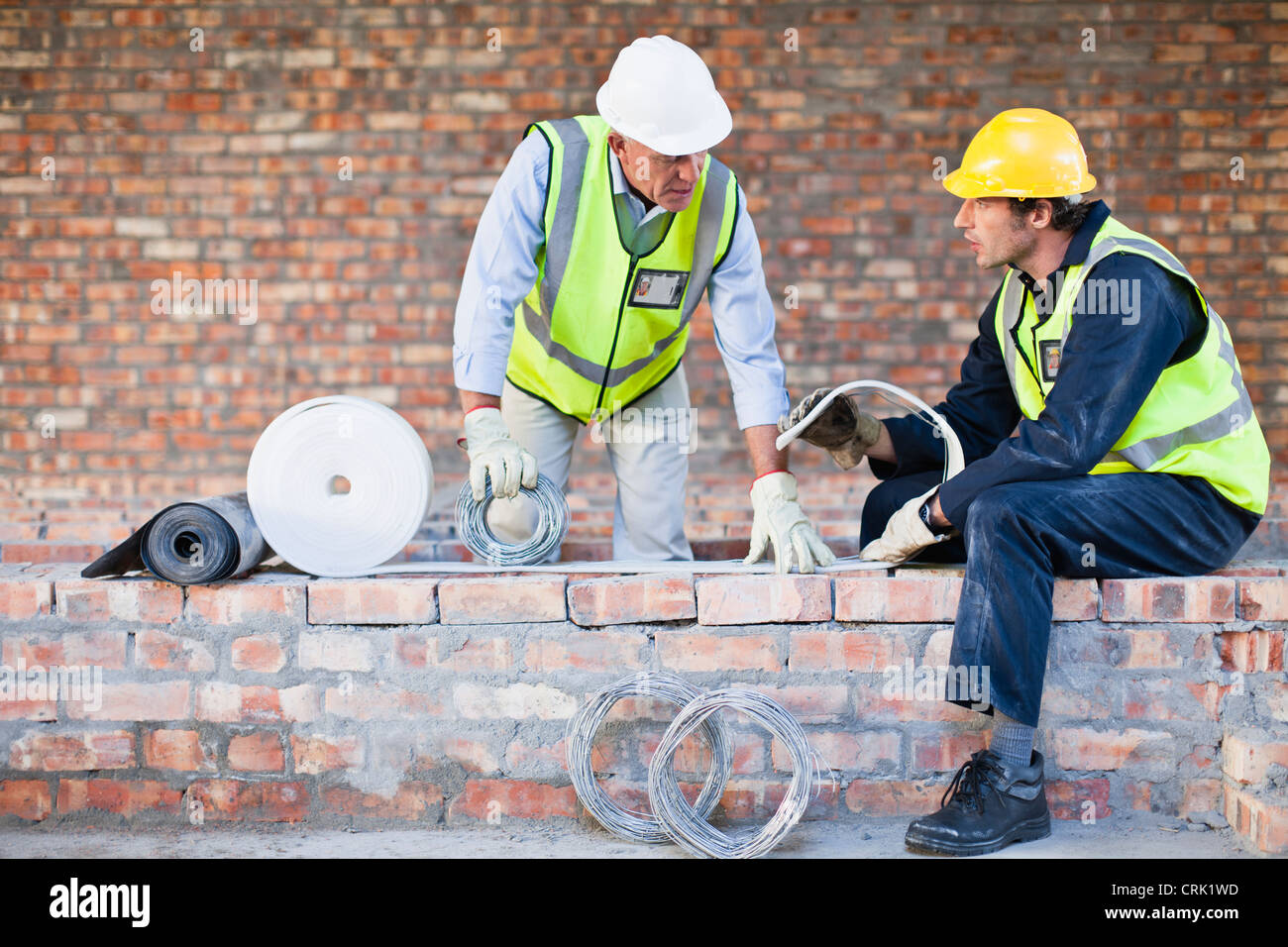 Construction worker on building site Stock Photo - Alamy
