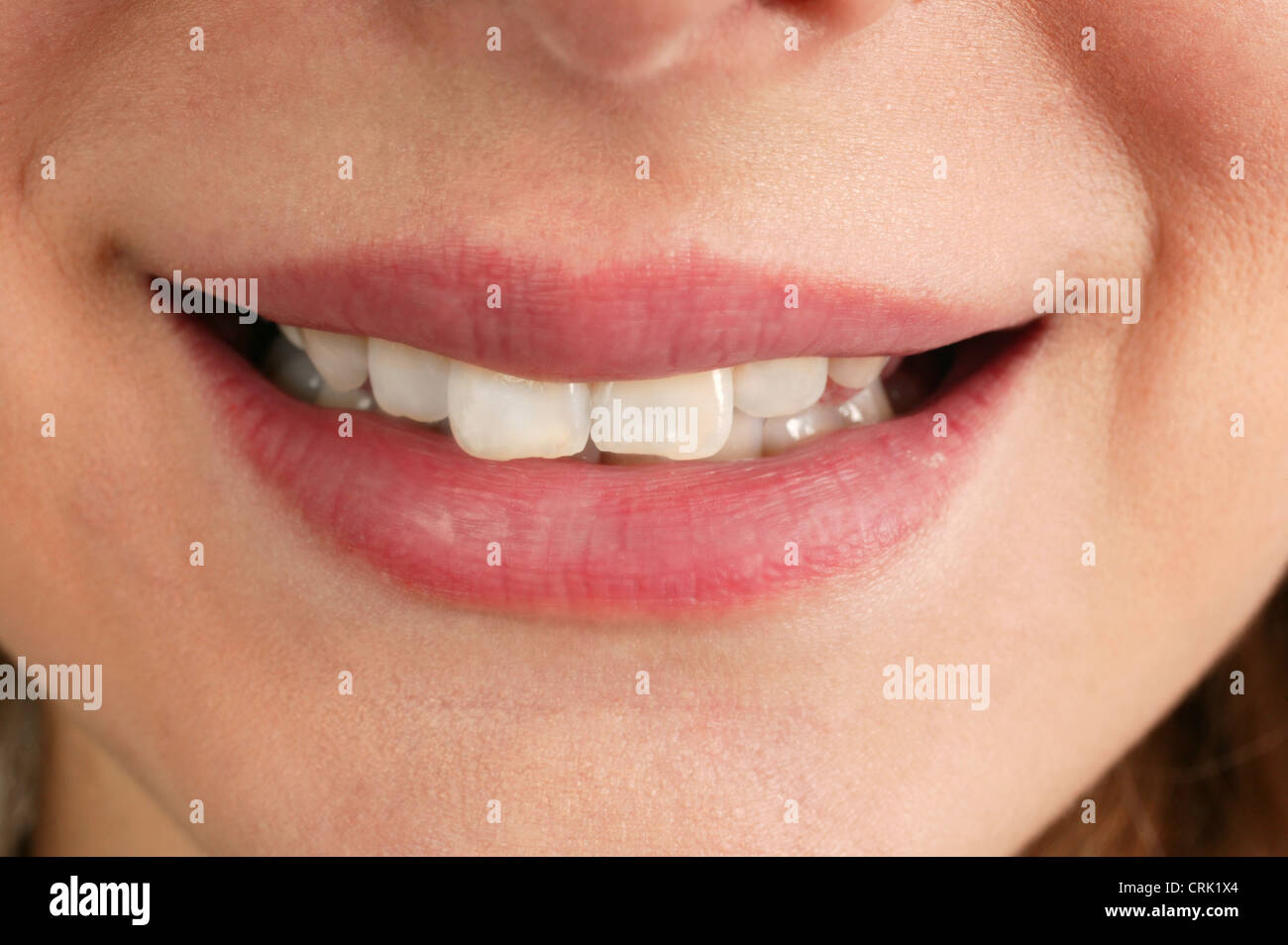 Mouth of a smiling woman, showing her teeth Stock Photo - Alamy