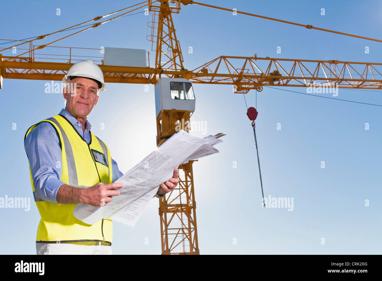 Worker reading blueprints on site hi-res stock photography and images ...