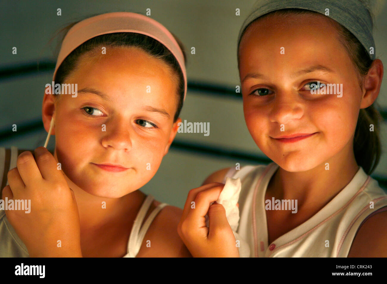 Two girls checking their faces for spots Stock Photo - Alamy