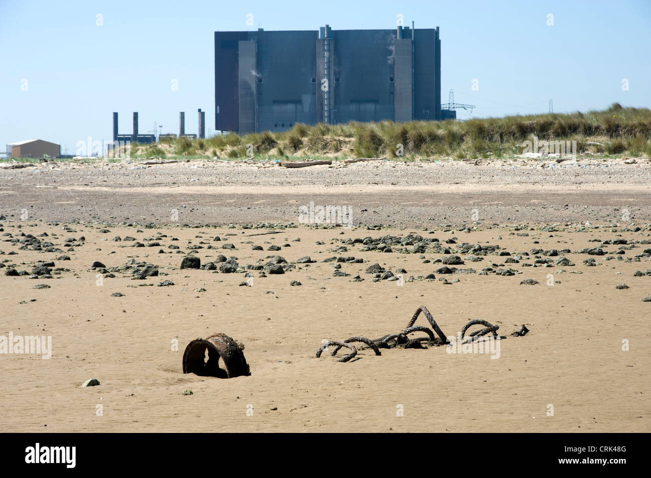 Metal objects buried in sand at Hartlepool Nuclear power station Stock ...