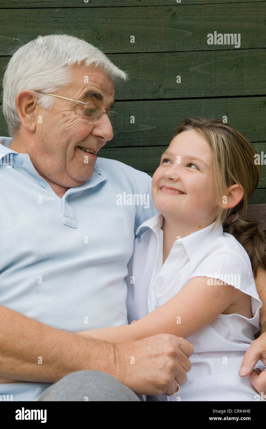Child hugging her grandad hi-res stock photography and images - Alamy