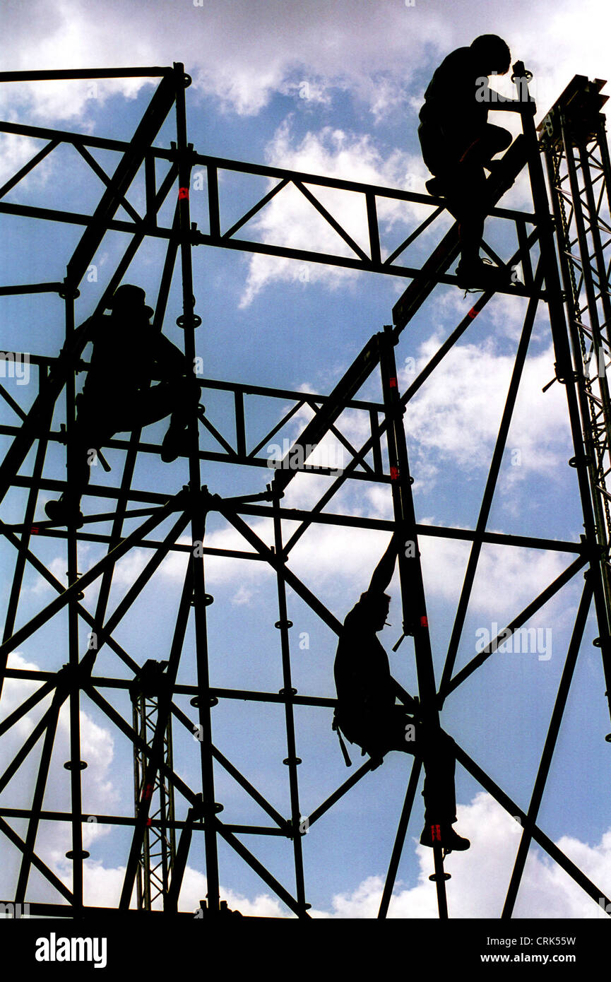 Silhouettes of several men in a scaffold Stock Photo - Alamy