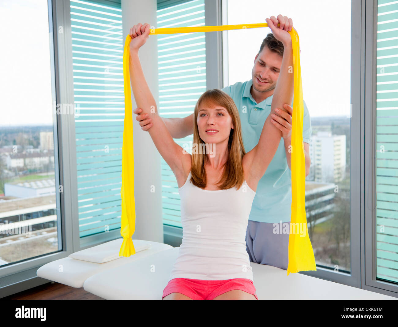 Doctor examining womans arms in office Stock Photo - Alamy
