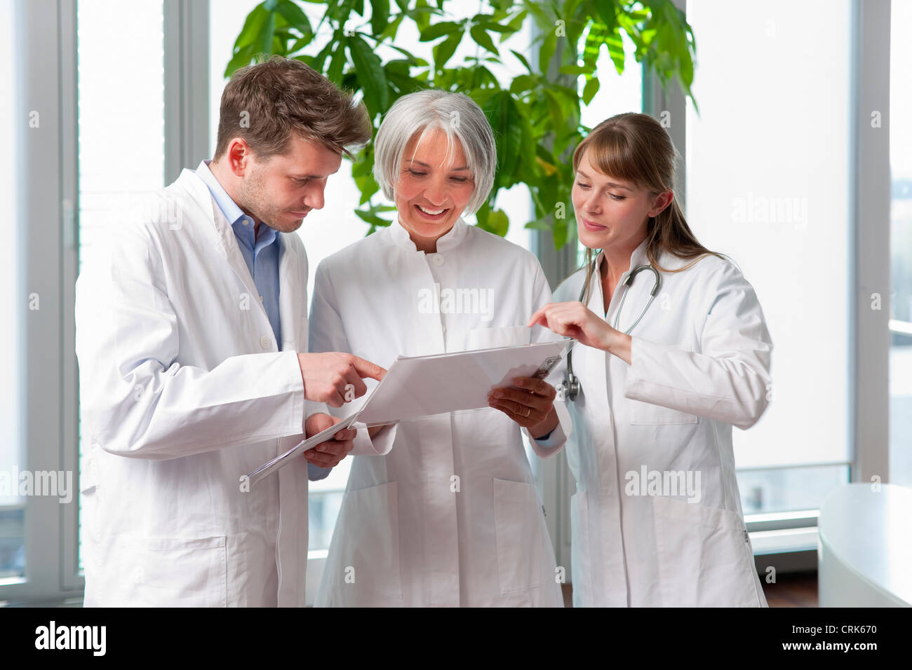 Doctors talking together in hospital Stock Photo - Alamy