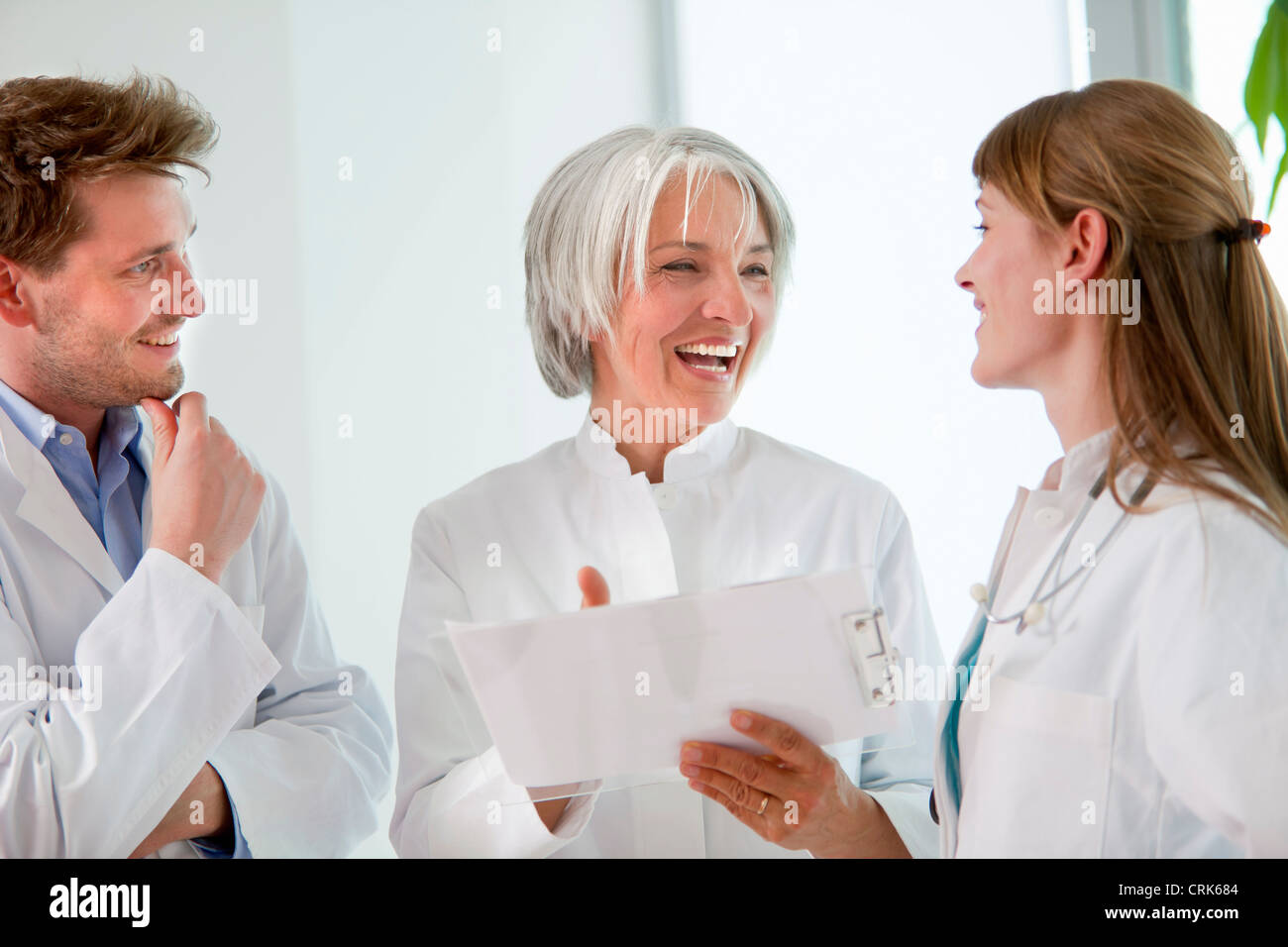 Doctors talking together in hospital Stock Photo - Alamy