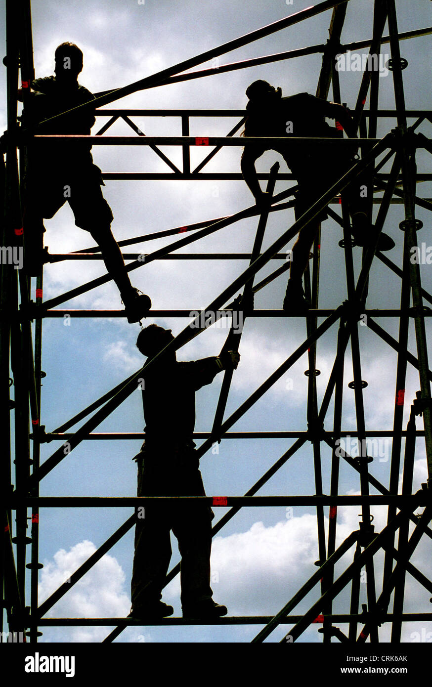 Silhouettes of several men in a scaffold Stock Photo - Alamy