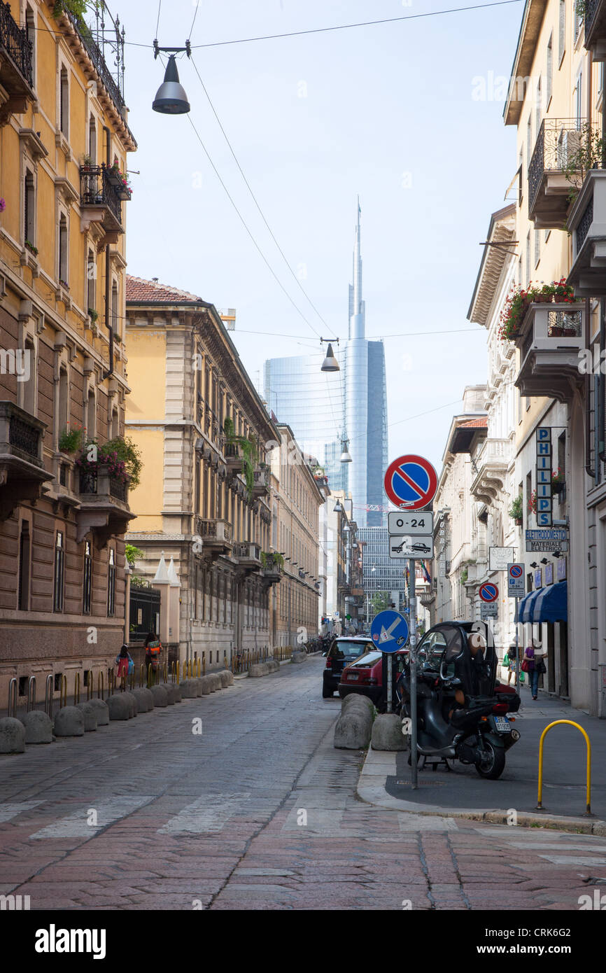 Street in Milan, Italy showing old buildings against modern building ...