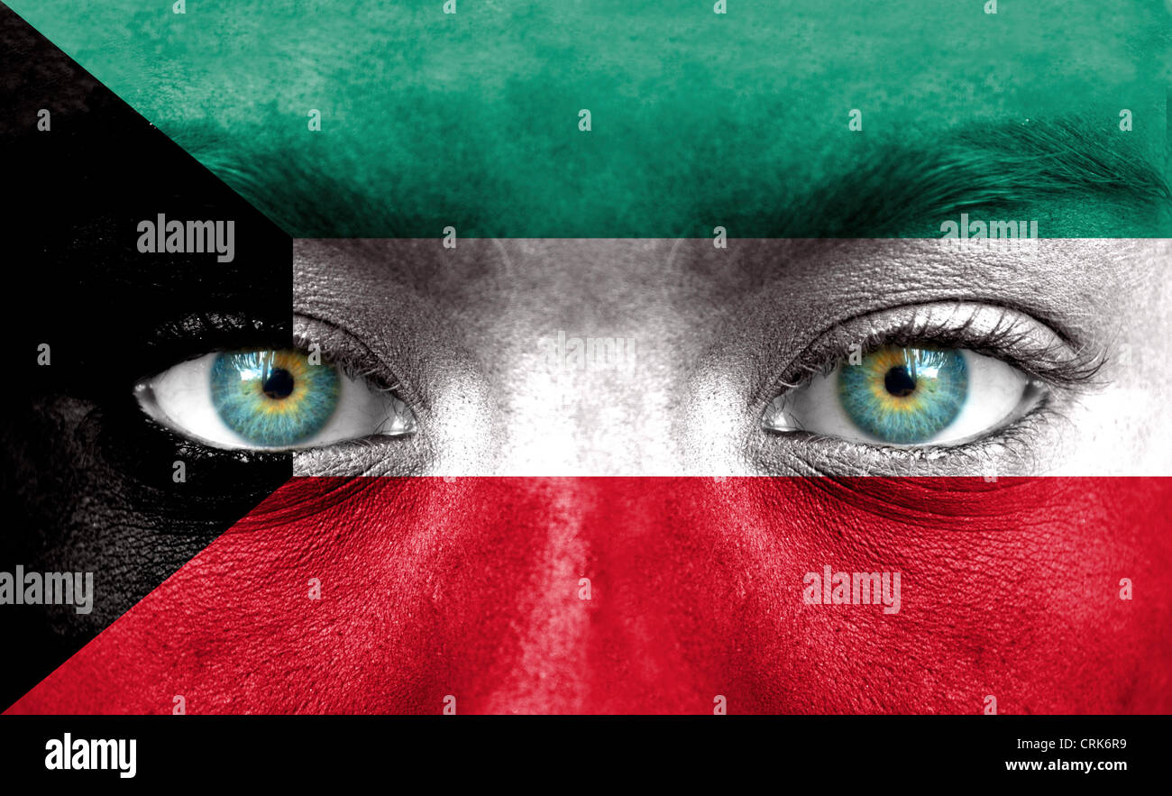 Human face painted with flag of Kuwait Stock Photo - Alamy